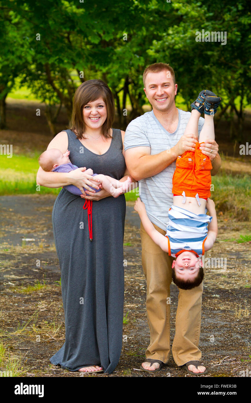 This family of four includes a mom, dad, 5 year old son, and a newborn ...