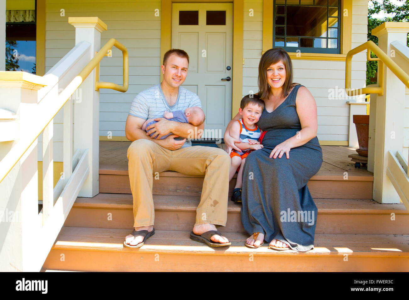 This family of four includes a mom, dad, 5 year old son, and a newborn ...
