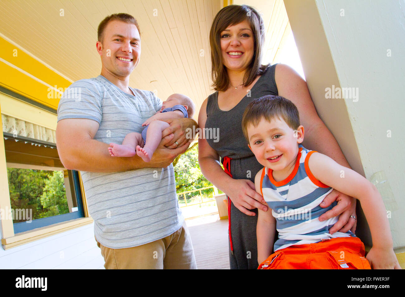 This family of four includes a mom, dad, 5 year old son, and a newborn ...