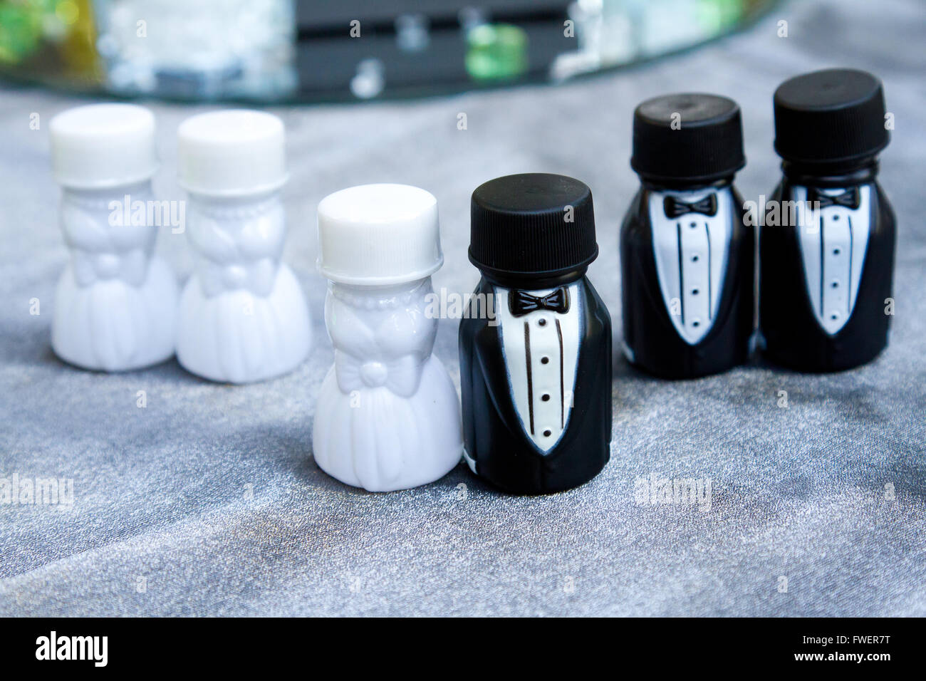 These party favors are containers of bubbles at a wedding. The ...