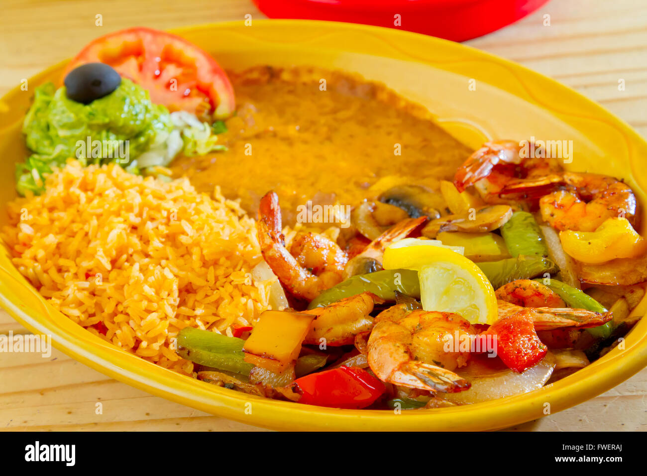 An authentic Mexican food restaurant has plated fajitas ready to serve ...