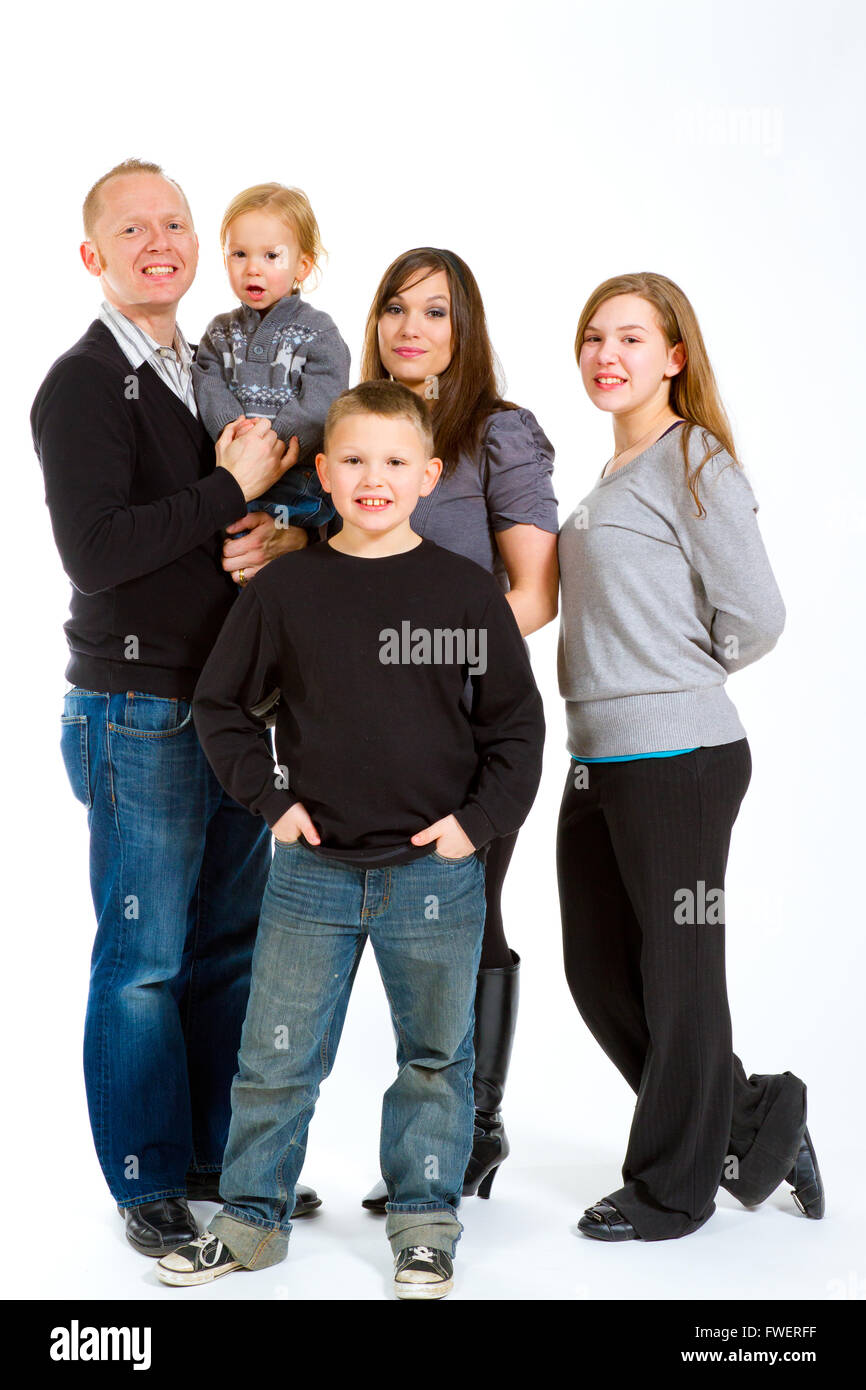 A family of five people on a white isolated background in the studio ...