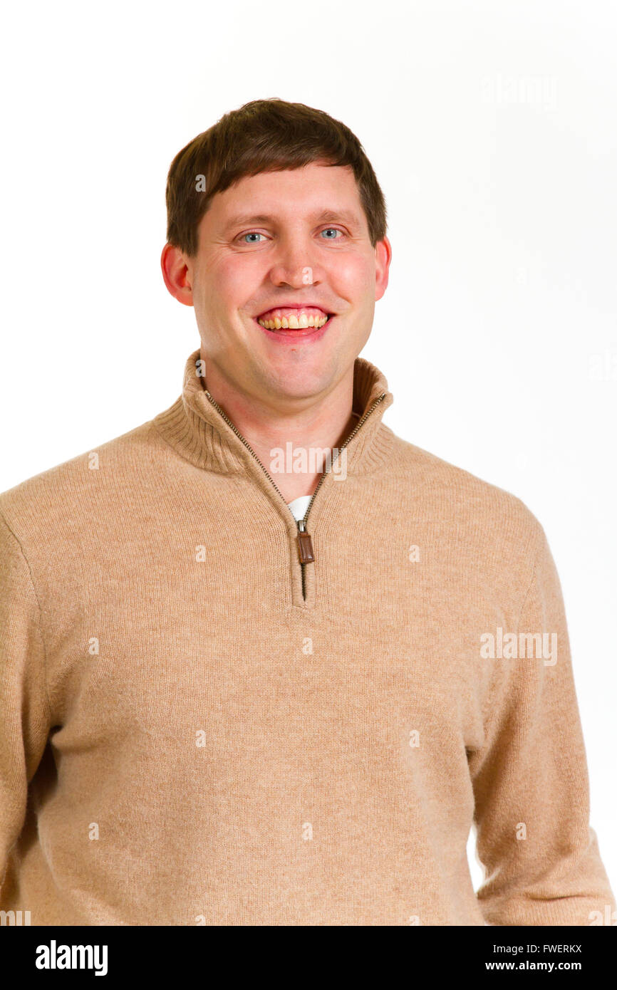An attractive man is photographed against a white background in the ...