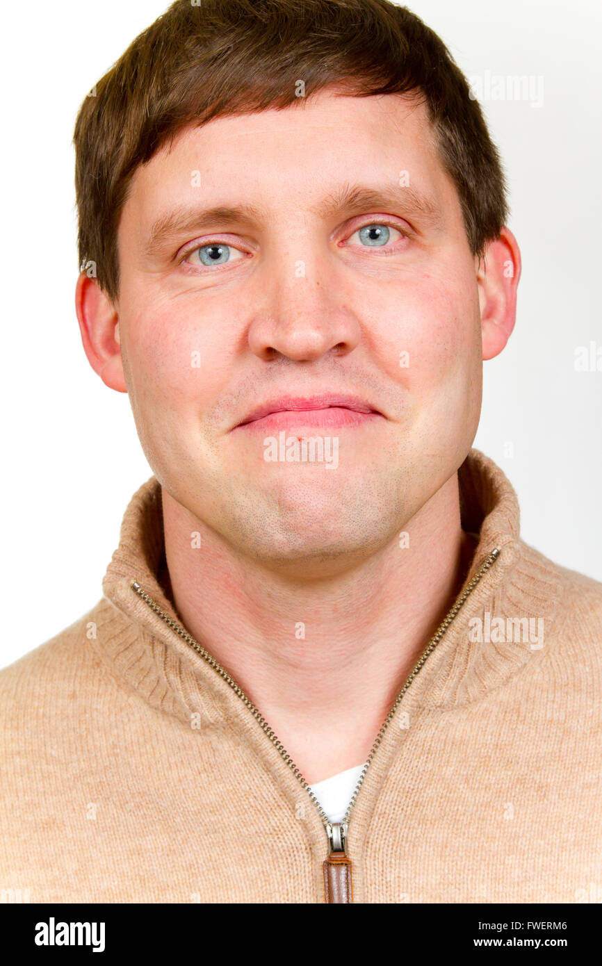 An attractive man is photographed against a white background in the ...