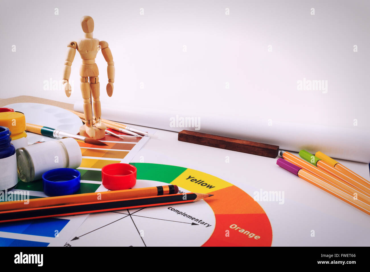 Office table desk with set of tools for creative art work on a white ...