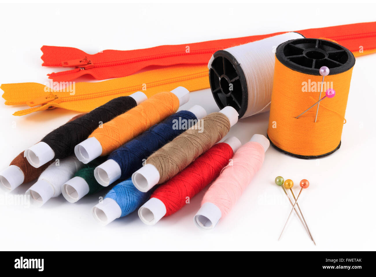 Spool of thread with needle, pins, zippers colorful sewing bobbin ...