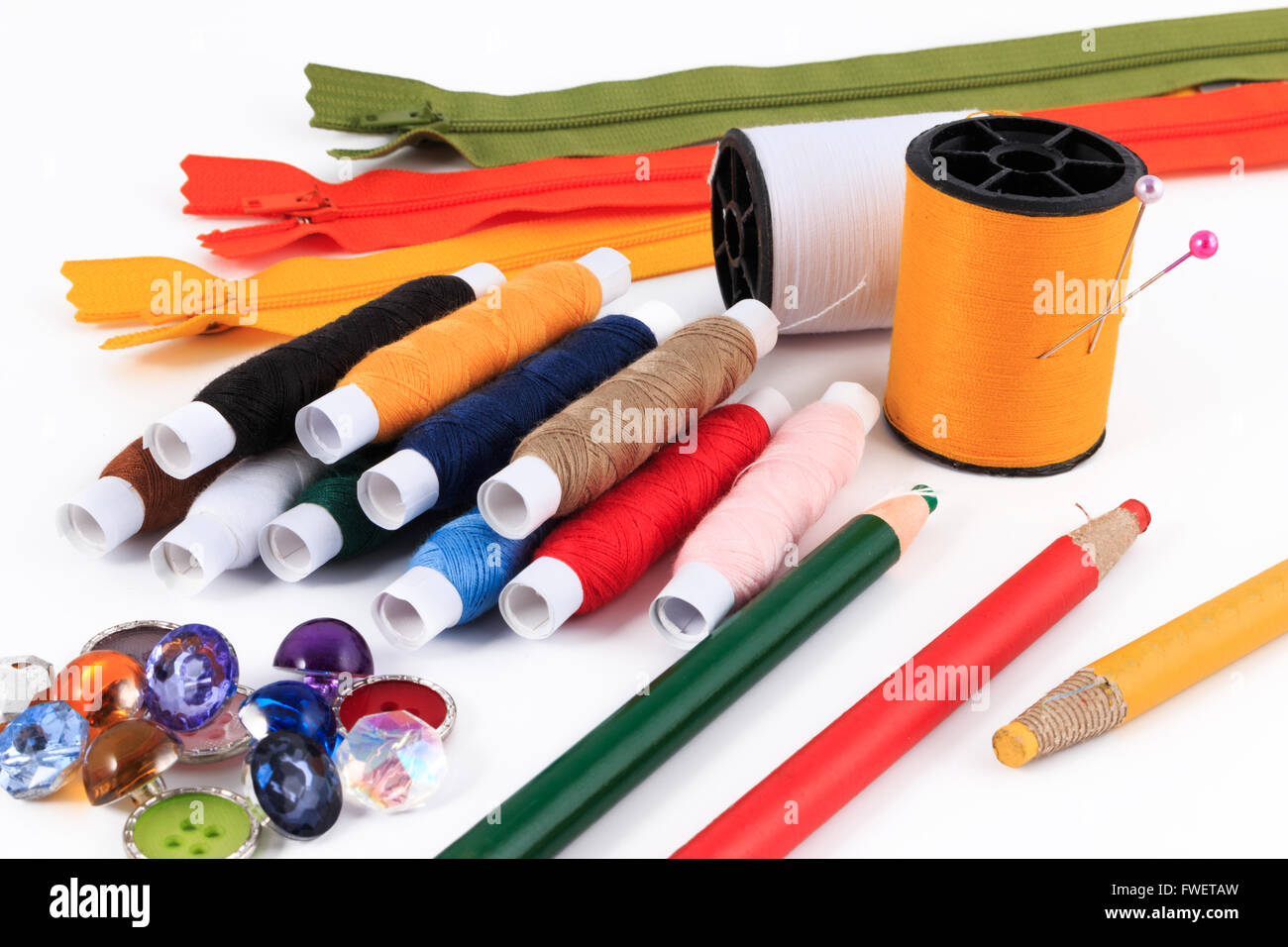 Spool of thread with needle, pins, zippers colorful sewing bobbin ...