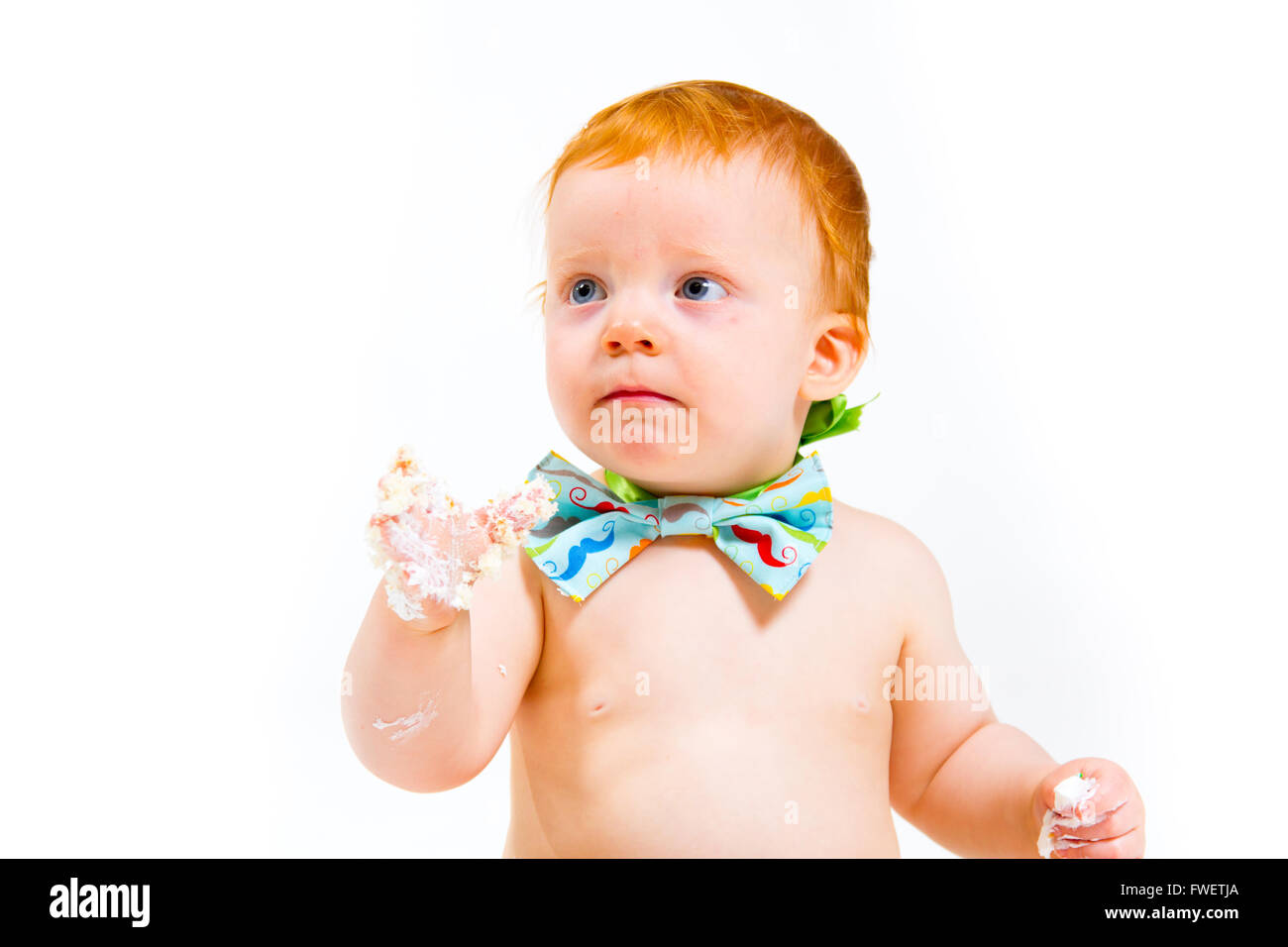 A baby boy gets to eat cake for the first time on his first birthday in ...