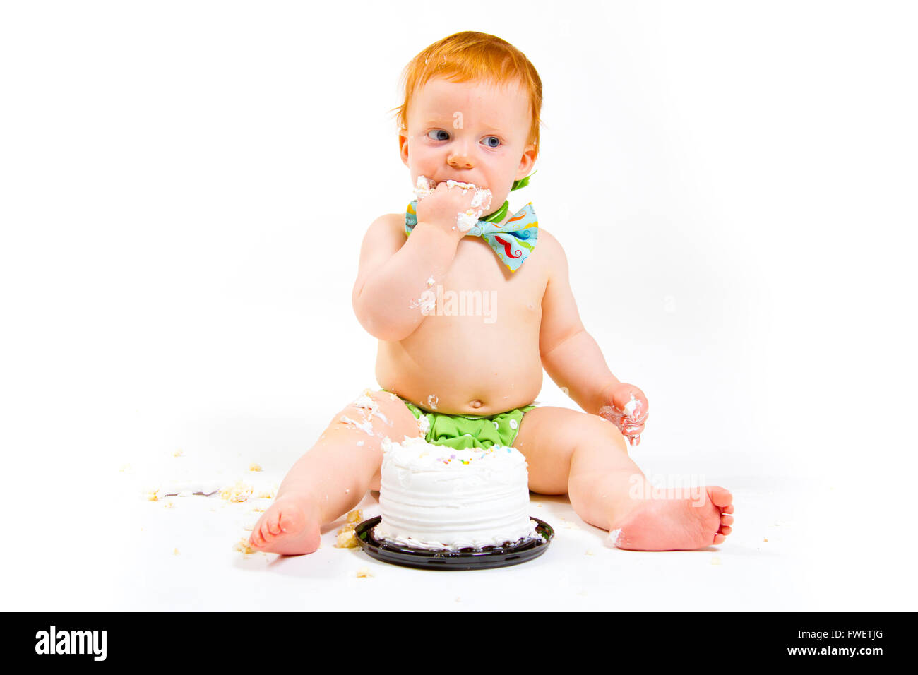 A baby boy gets to eat cake for the first time on his first birthday in ...