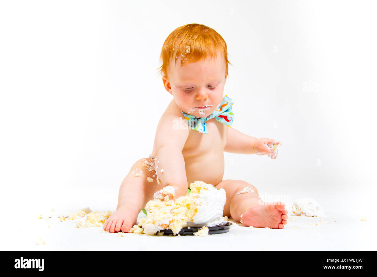 A baby boy gets to eat cake for the first time on his first birthday in ...