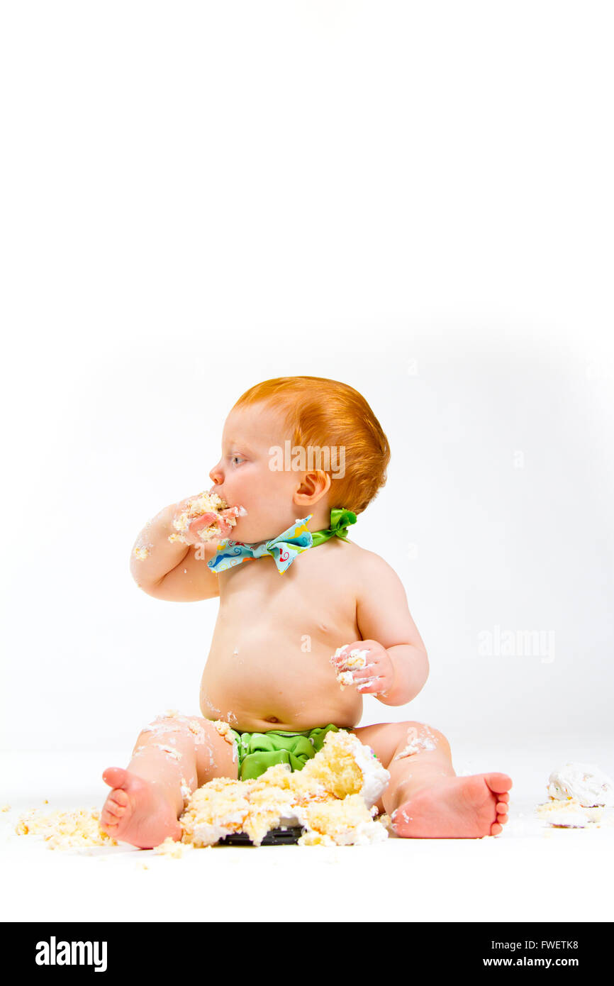 A baby boy gets to eat cake for the first time on his first birthday in ...
