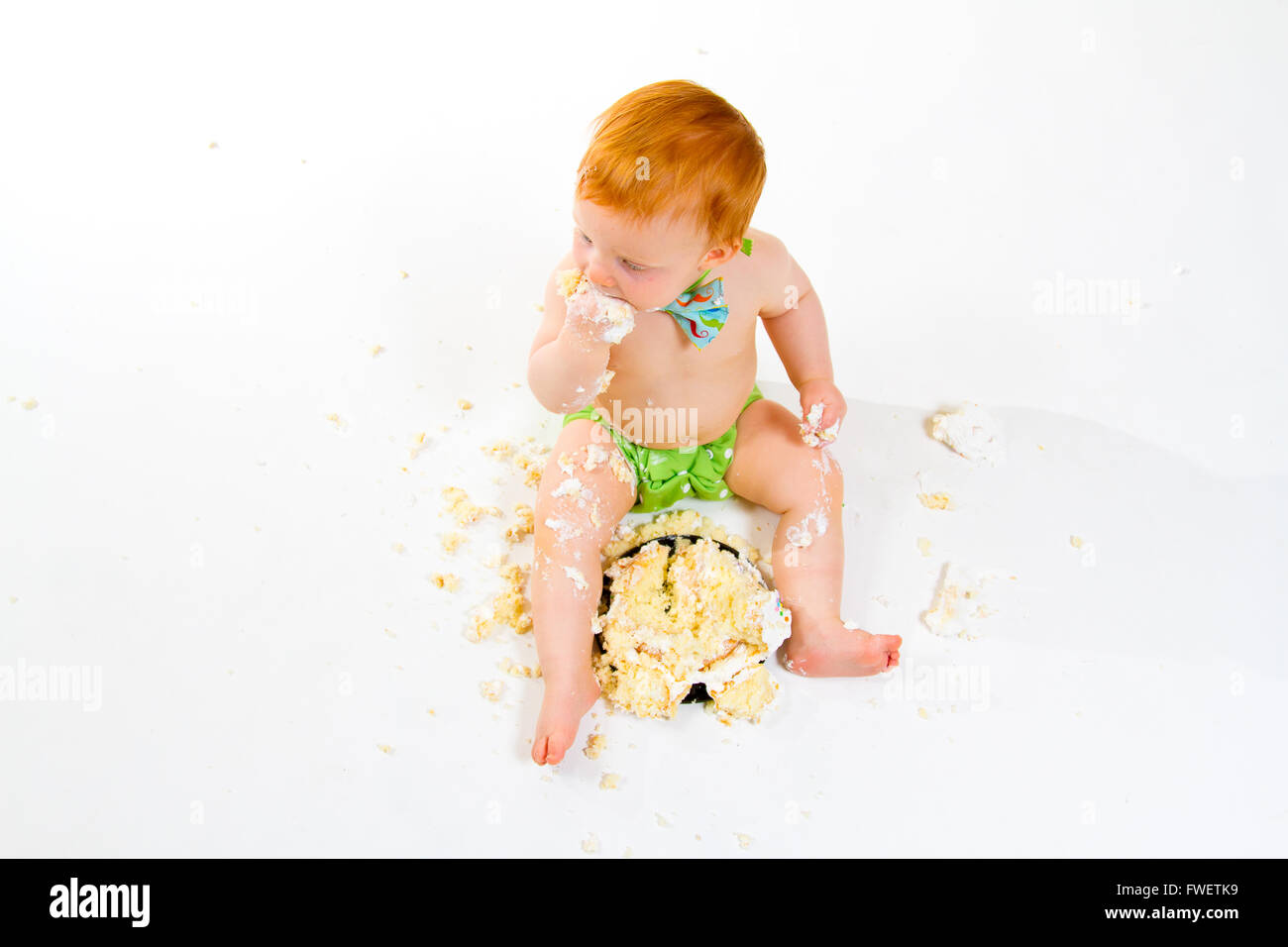 A baby boy gets to eat cake for the first time on his first birthday in ...