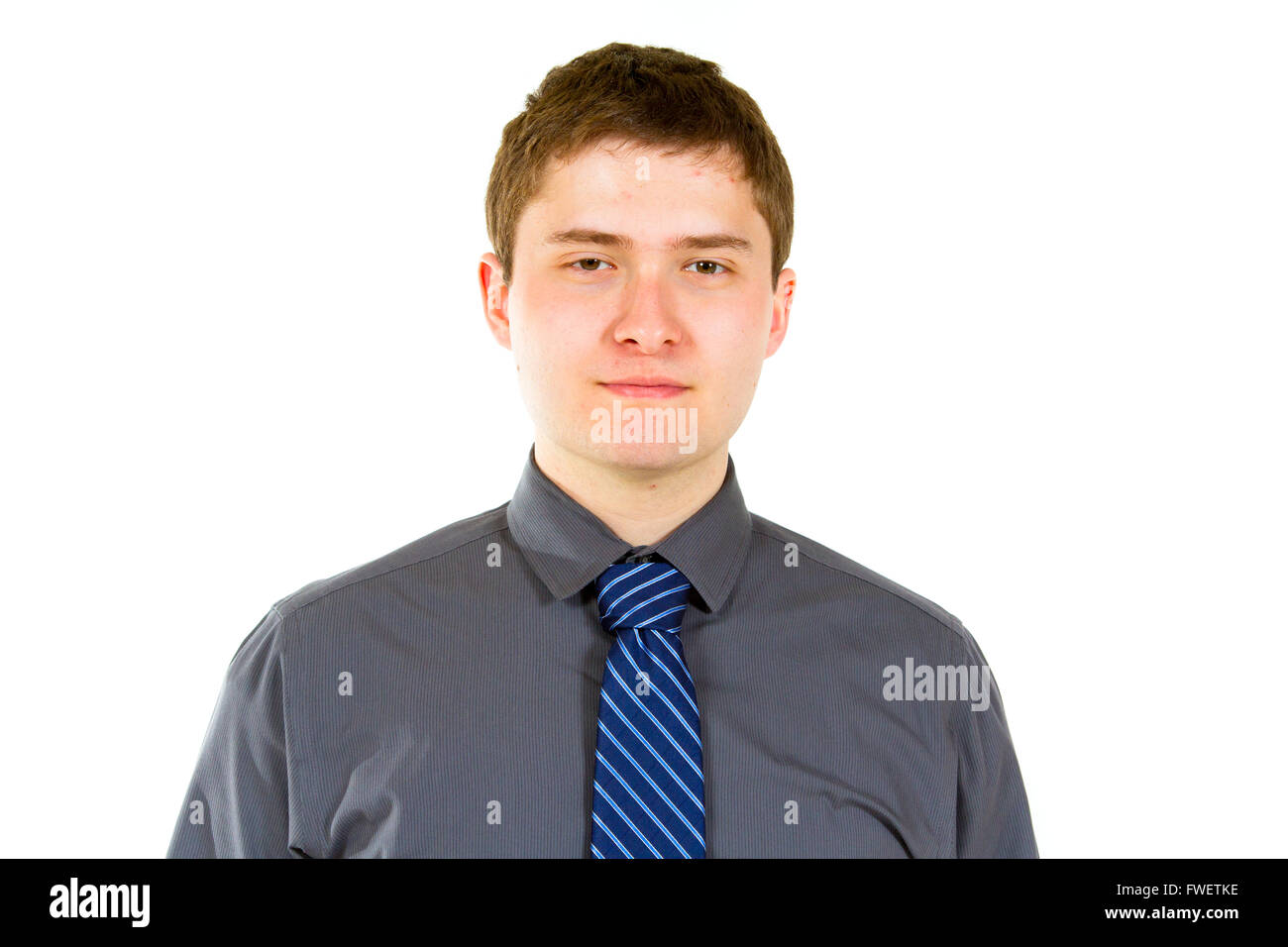 A young adult college student is photographed in the studio agains an ...