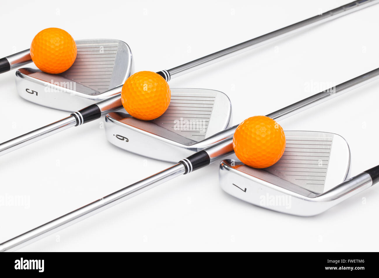 Titanium golf clubs on the white background Stock Photo - Alamy