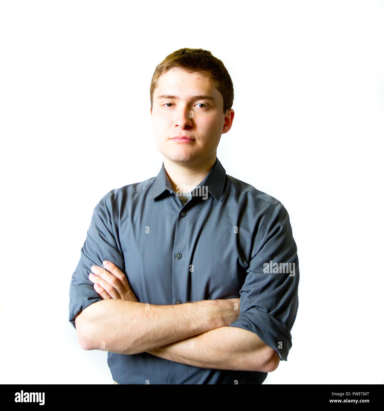 A young adult college student is photographed in the studio agains an ...