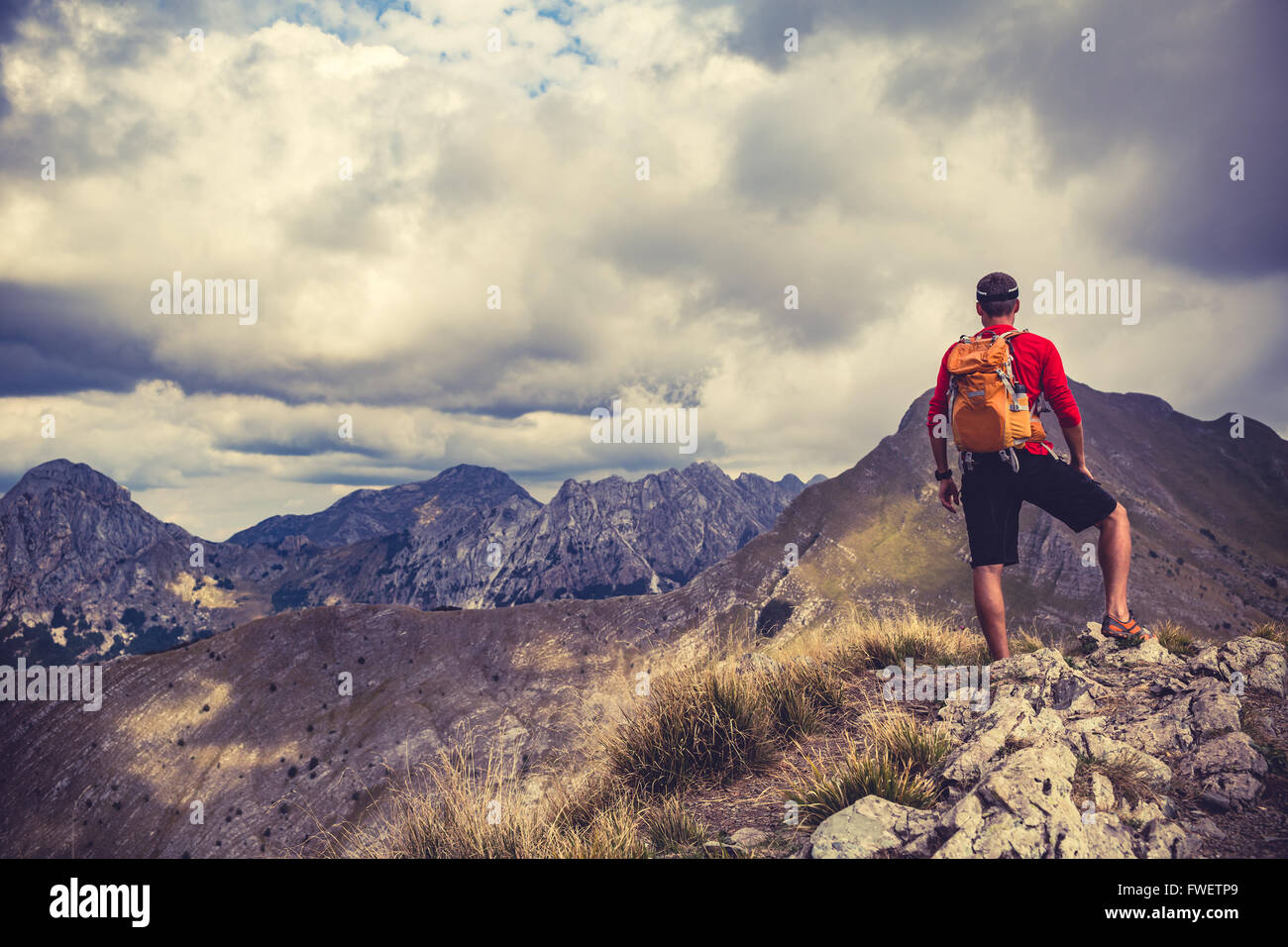 Hiking man, climber or trail runner in mountains, inspirational ...