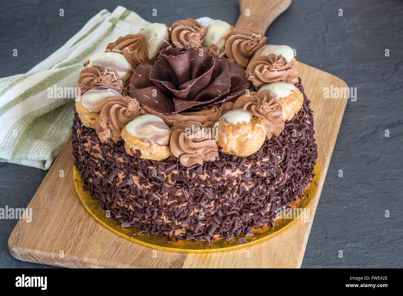 Large Chocolate cake with profiteroles Stock Photo - Alamy