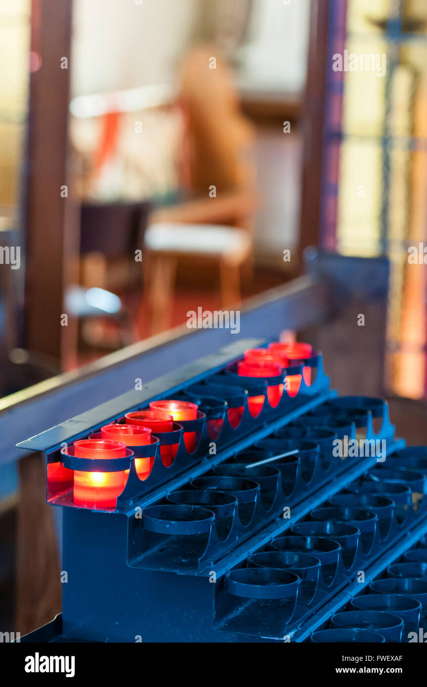 Lit candles in holder hi-res stock photography and images - Alamy