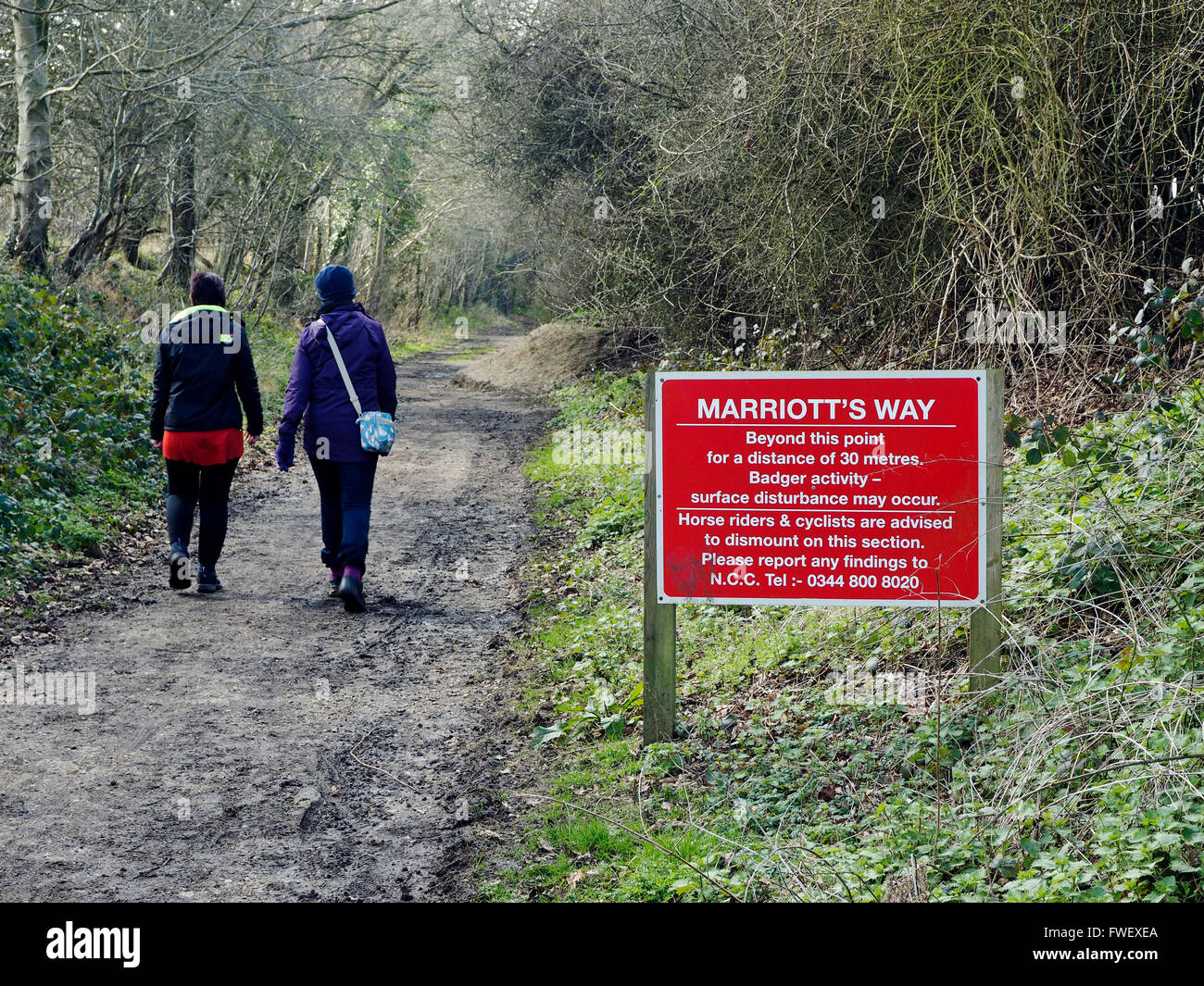 Walkers on the Marriott's Way shared use path along an abandoned ...