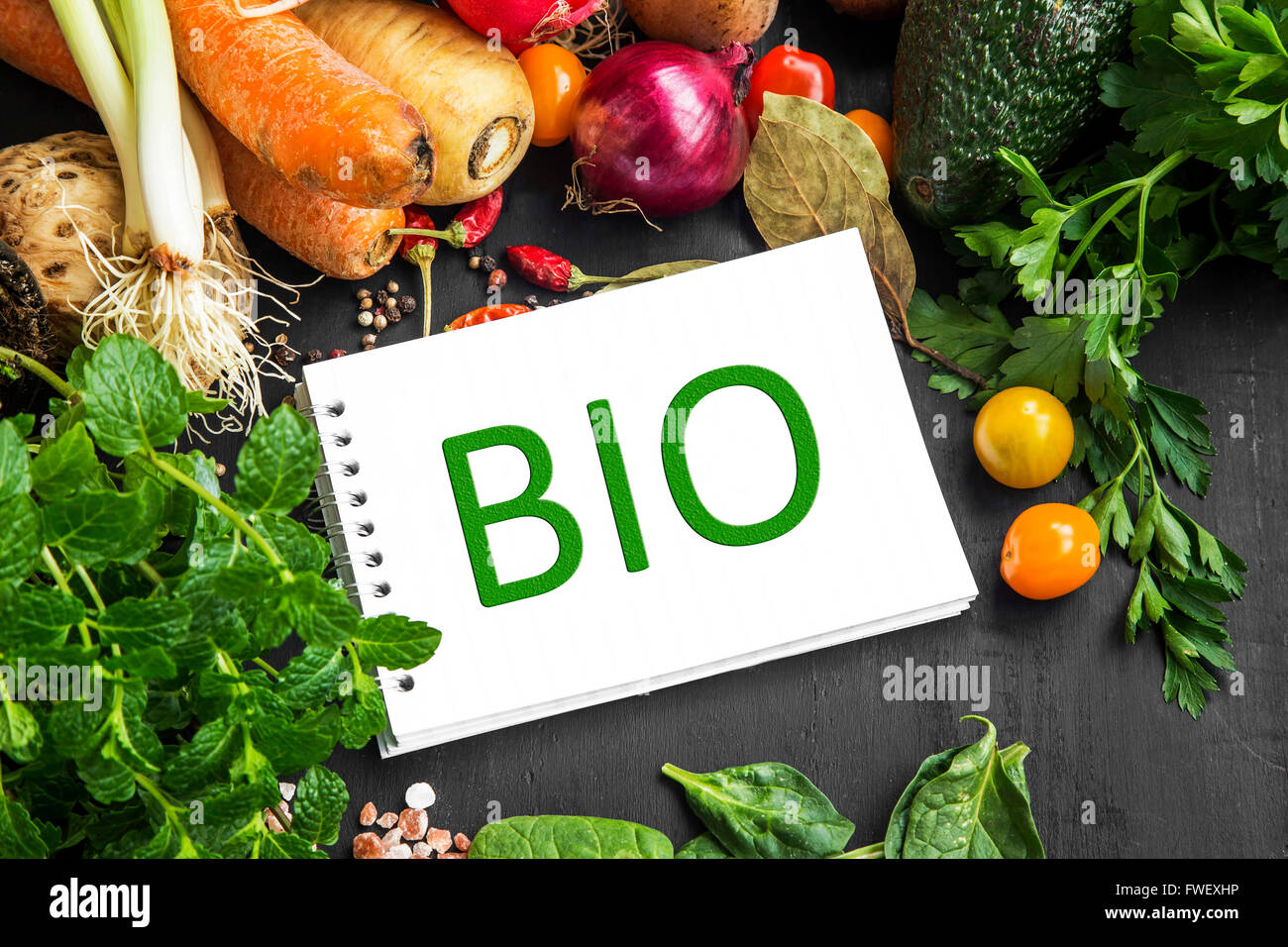 Bio vegetables and greens frame with bio note, tomatoes, carrots, onion ...