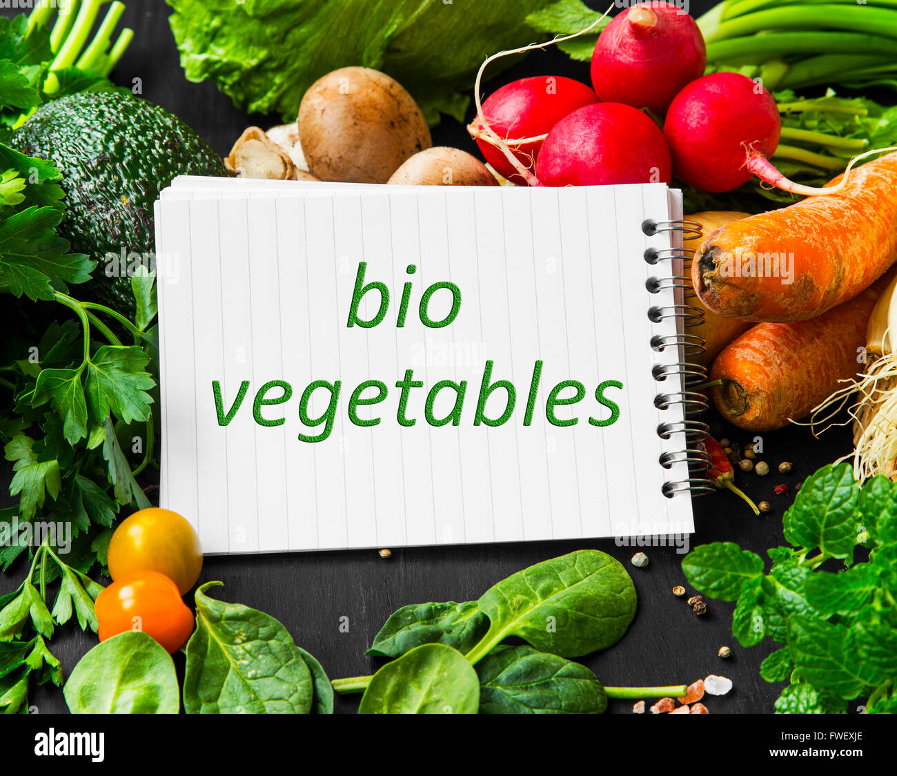 Bio vegetables and greens frame with bio note, tomatoes, carrots, onion ...