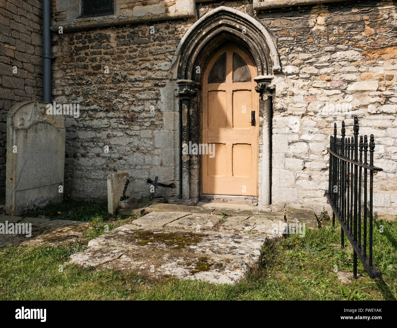 Typically designed English church seen with a small cemetery in the ...