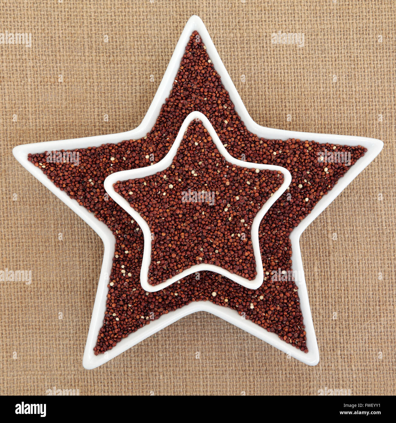 Quinoa grain super food in star shaped dishes over hessian background ...