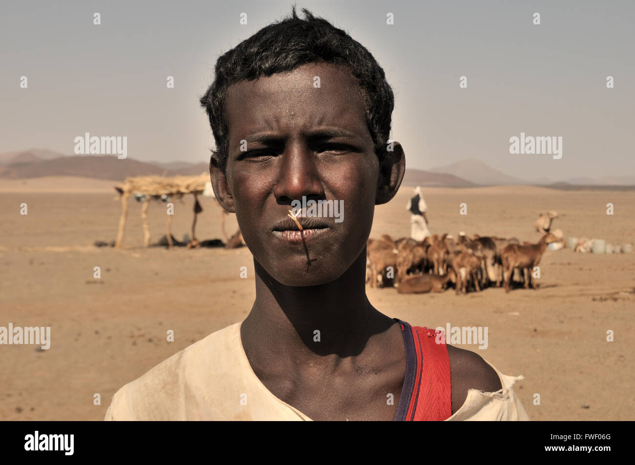 Bayuda desert, Bisharin nomad young man at well Stock Photo - Alamy