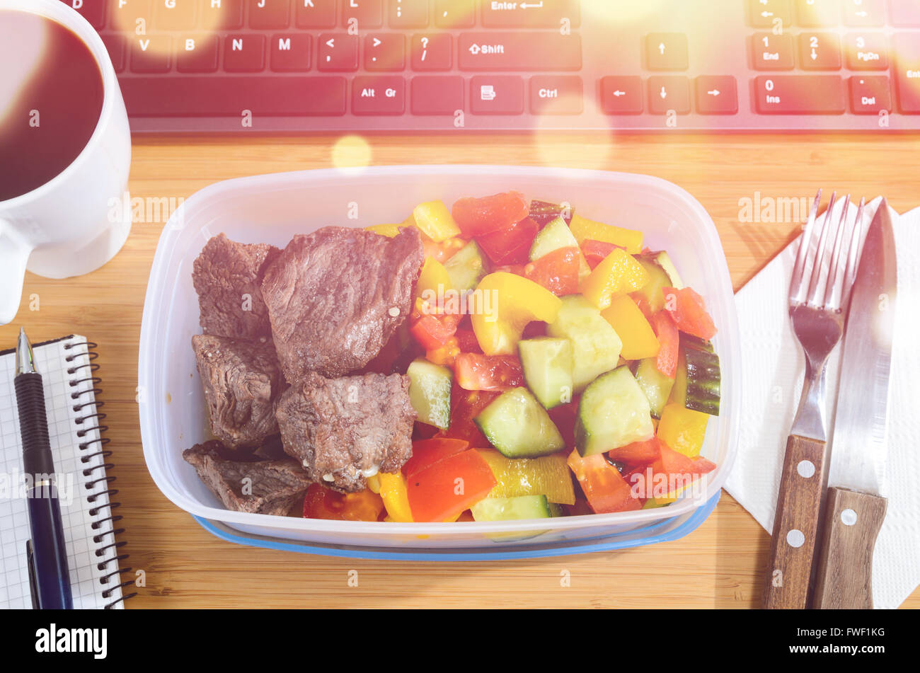 eating at workplace Stock Photo - Alamy