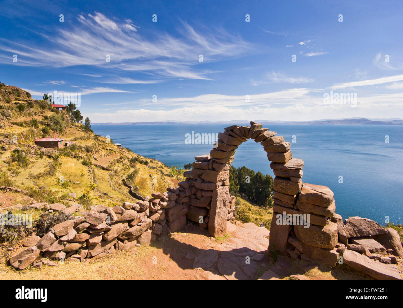 arch above titicaca lake in peru with blue sky Stock Photo - Alamy