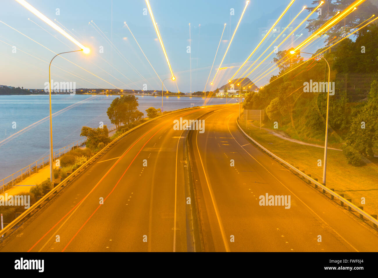 Tauranga Takatimu Expressway night scene with vehicle and street lights ...