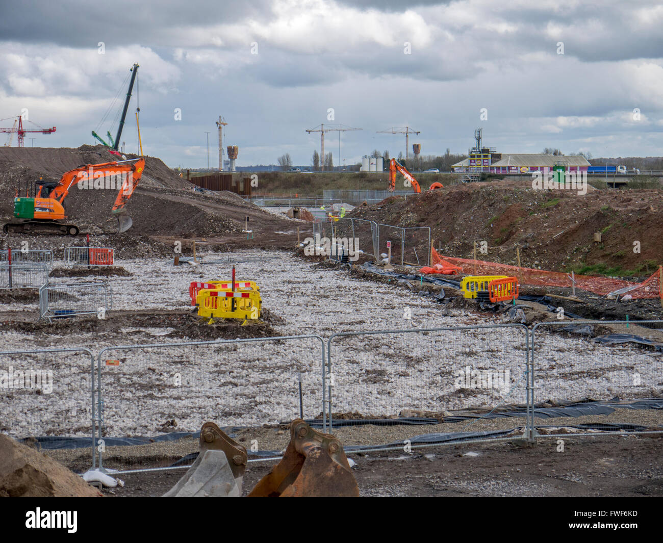 Construction site making way for new road layout. Cranes in the ...