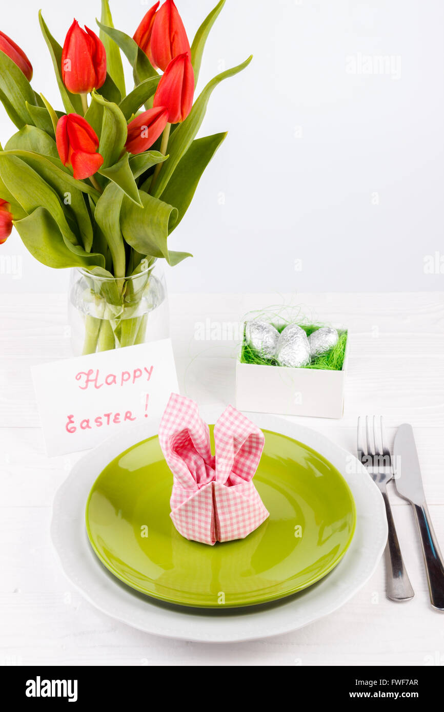 Easter table setting on white wooden table Stock Photo - Alamy