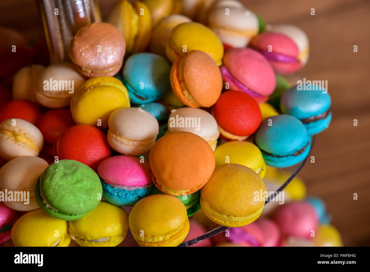 Different colors of macarons with side light Stock Photo - Alamy
