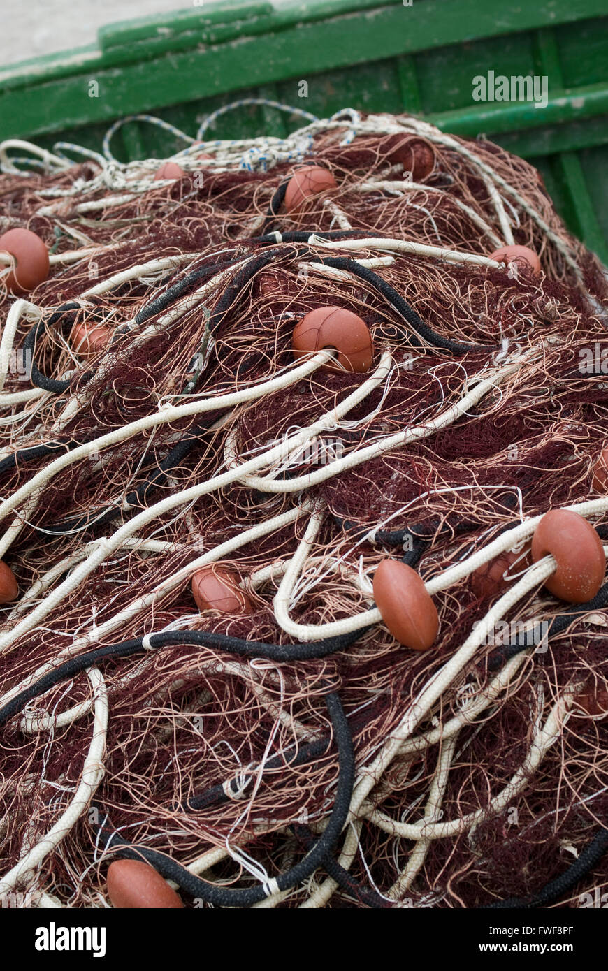 Detail of fishing nets piled up Stock Photo - Alamy