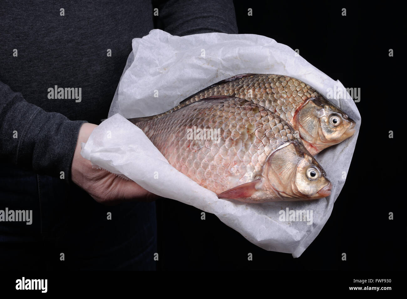 Man holding carp hi-res stock photography and images - Alamy