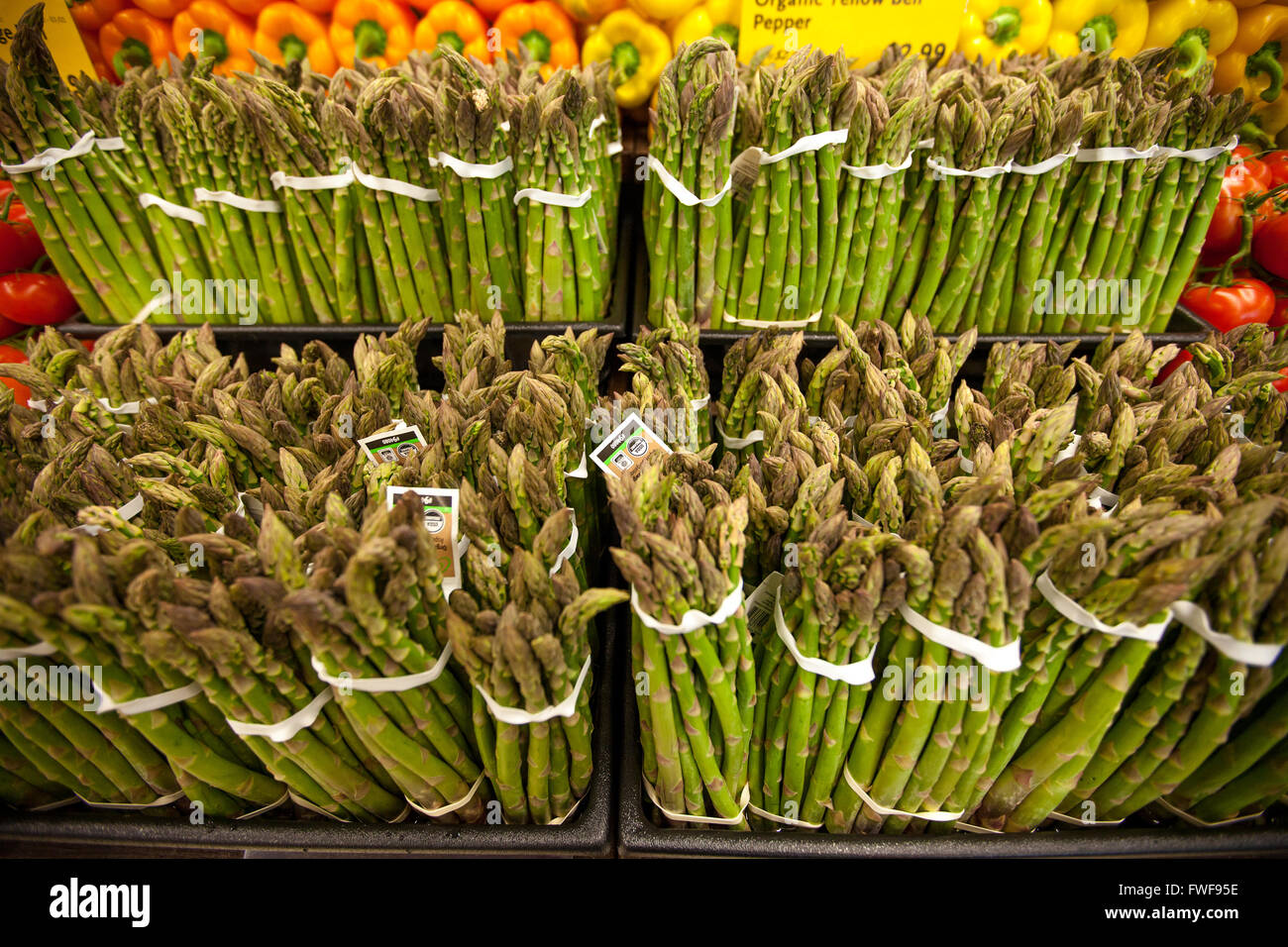 stacks of fresh produce on display at a natural foods grocery store ...