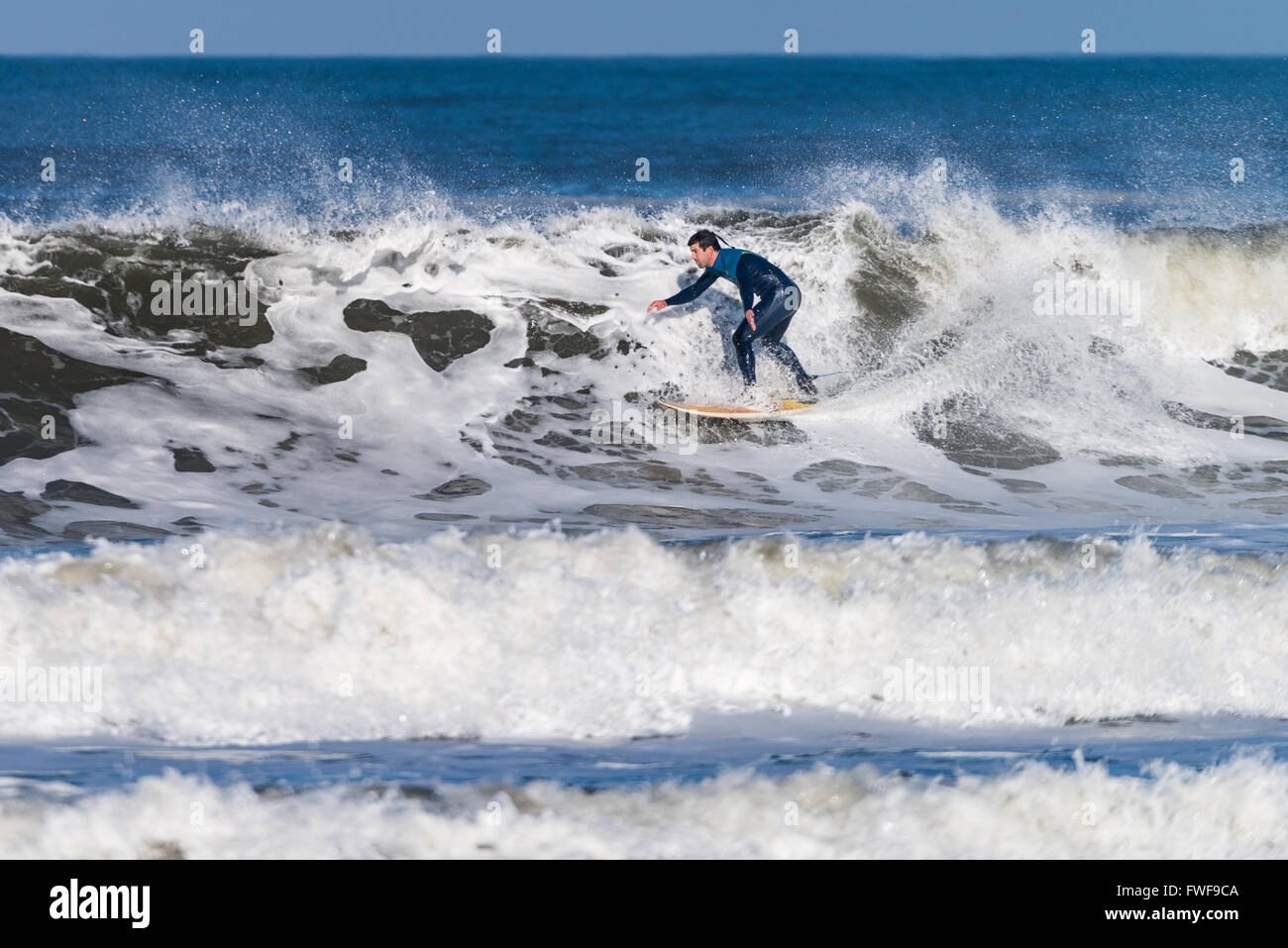 Surfer in action on the ocean waves on a sunny day Stock Photo - Alamy