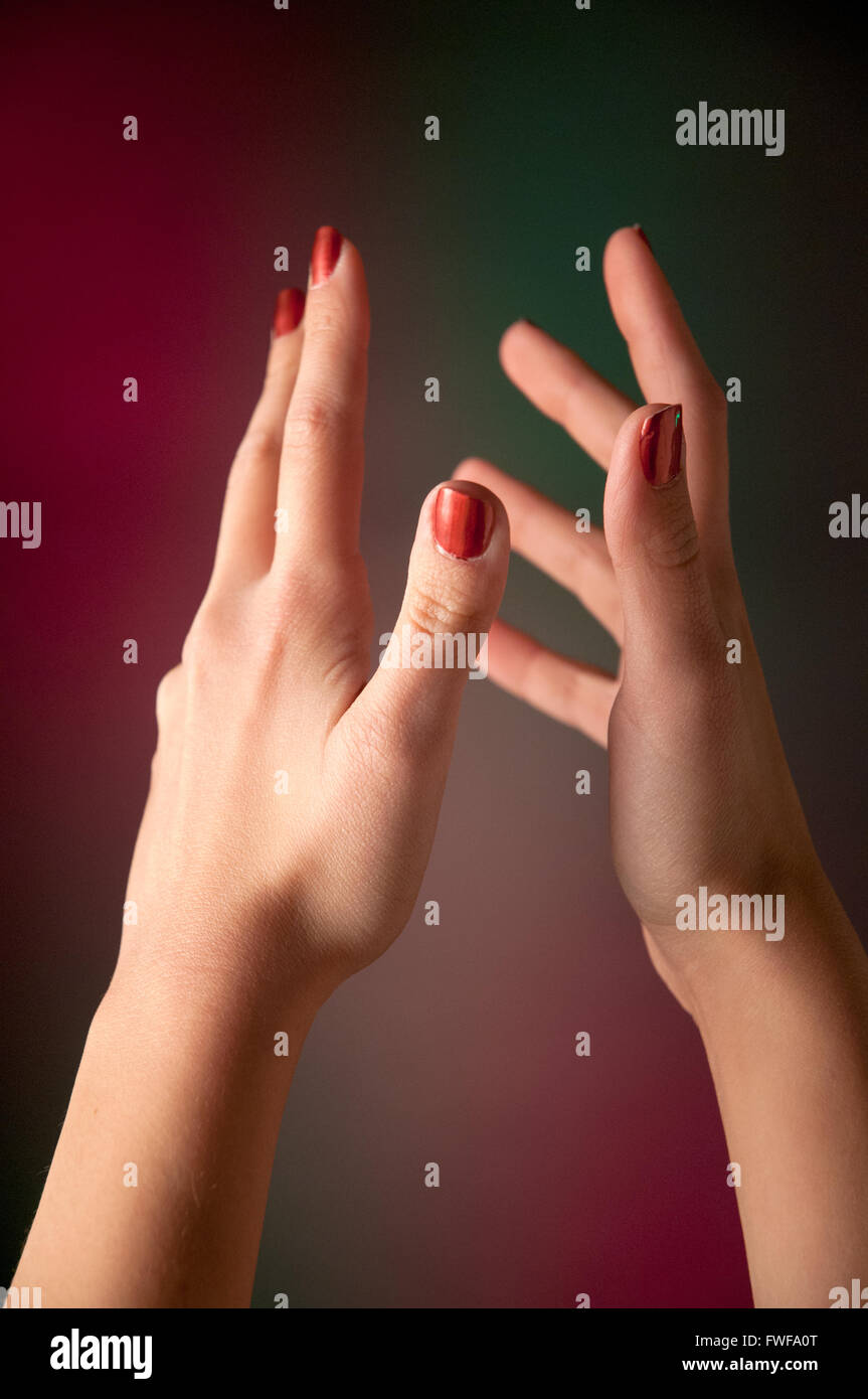 Pair of womans hands reaching upward Stock Photo - Alamy