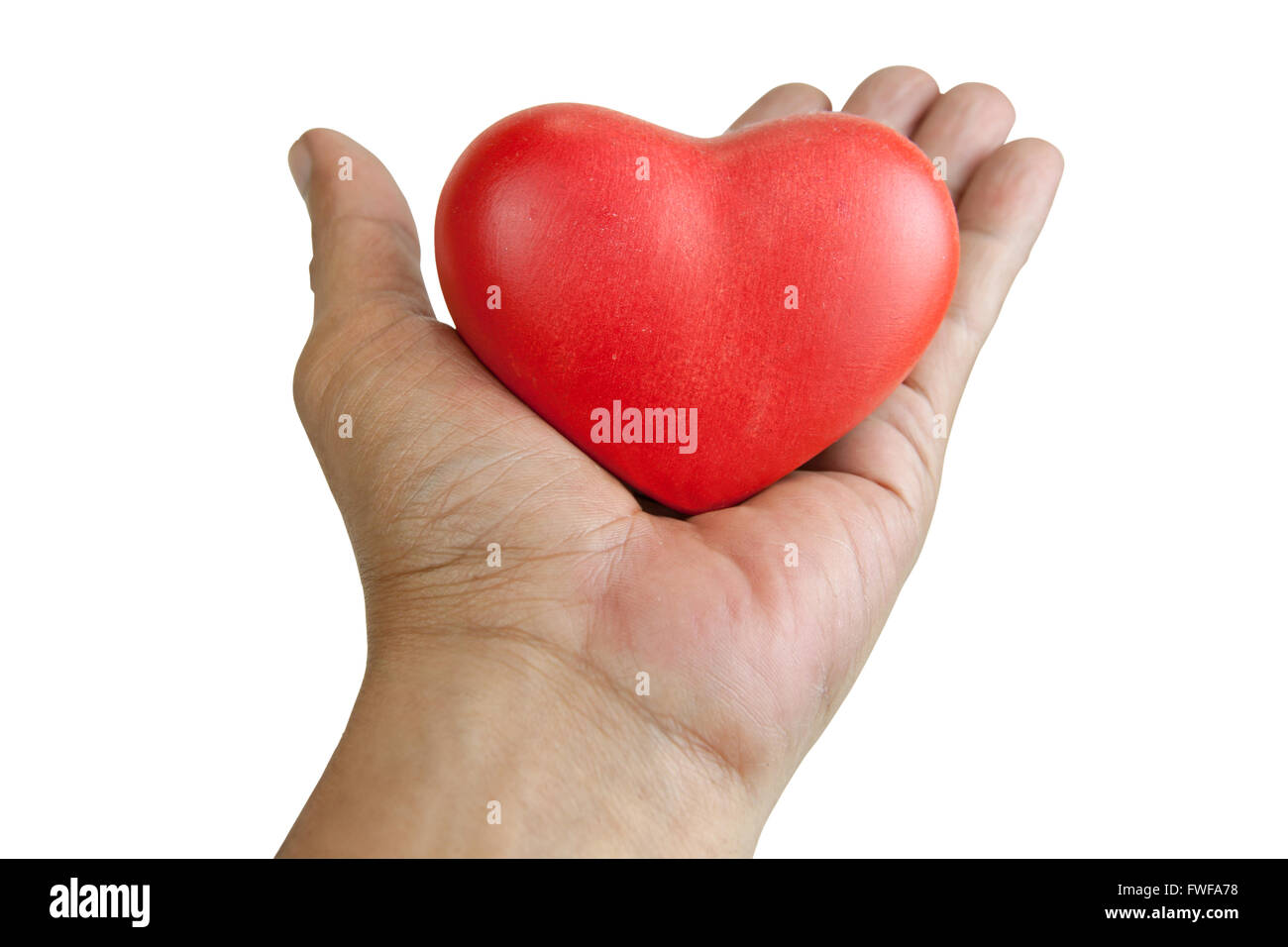 handle with heart care. Hand holding a red heart. isolated white ...