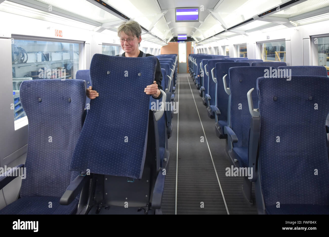 Berlin, Germany. 4th Apr, 2016. A vehicle maintainer repairing a seat ...