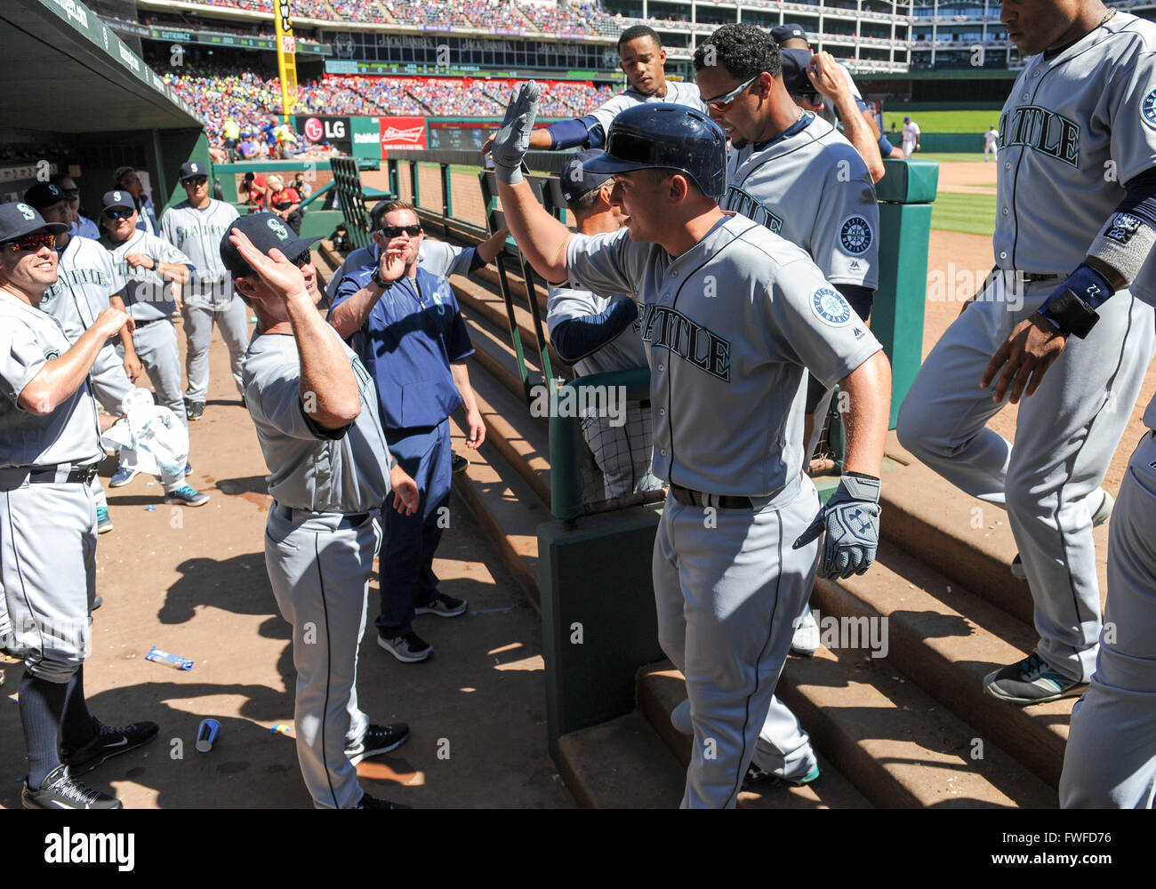 APR 04, 2016: Seattle Mariners third baseman Kyle Seager #15 is greeted ...
