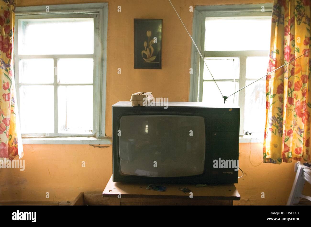 An old TV in a room of a poor family home in Ukraine. The room is ...