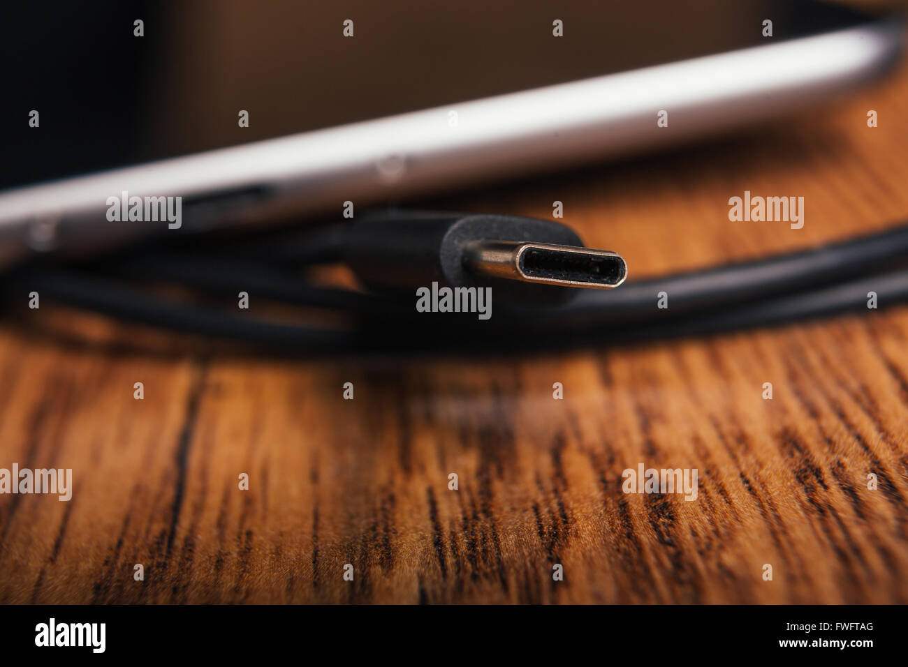 new tablet with built-in usb-c on wooden background Stock Photo - Alamy