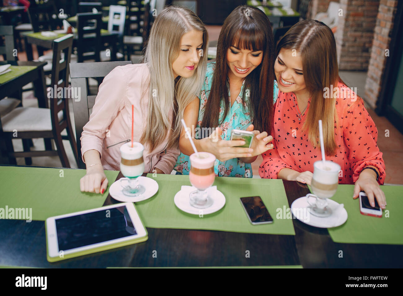 Girls with phones Stock Photo - Alamy