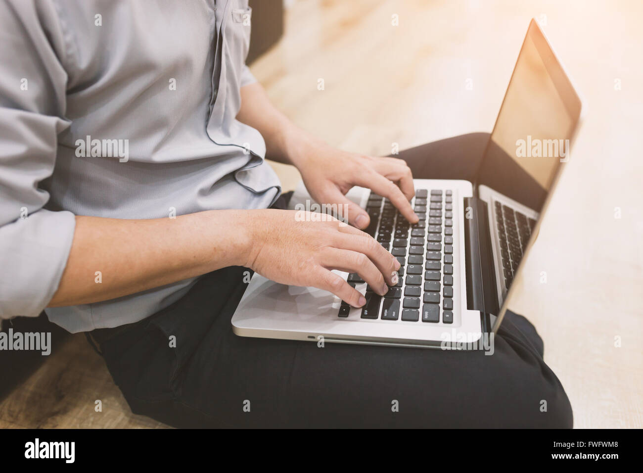 A man sit and using notebook Stock Photo - Alamy