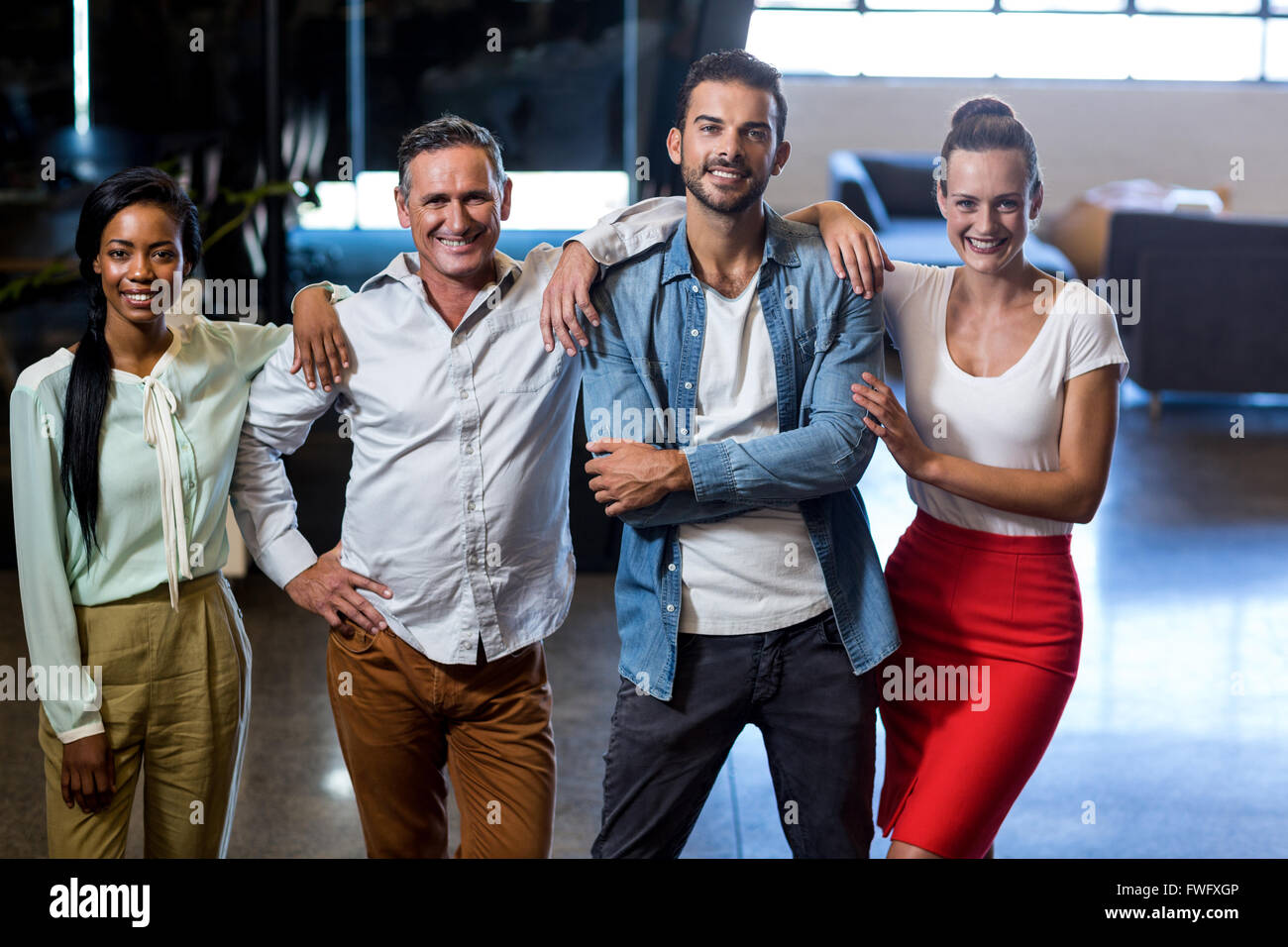 Team of colleagues posing together Stock Photo - Alamy