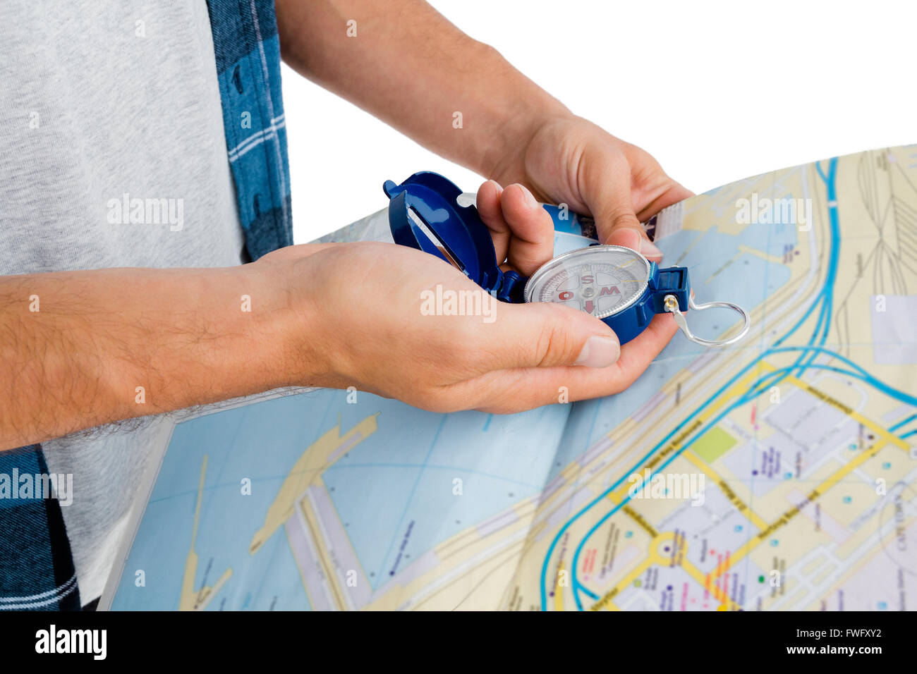 Man holding map and compass Stock Photo - Alamy