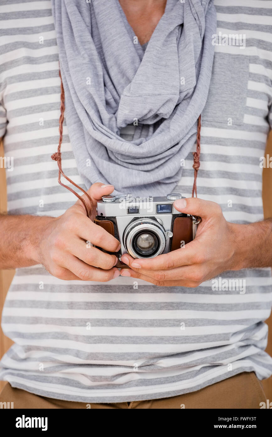 Man standing with a camera Stock Photo - Alamy