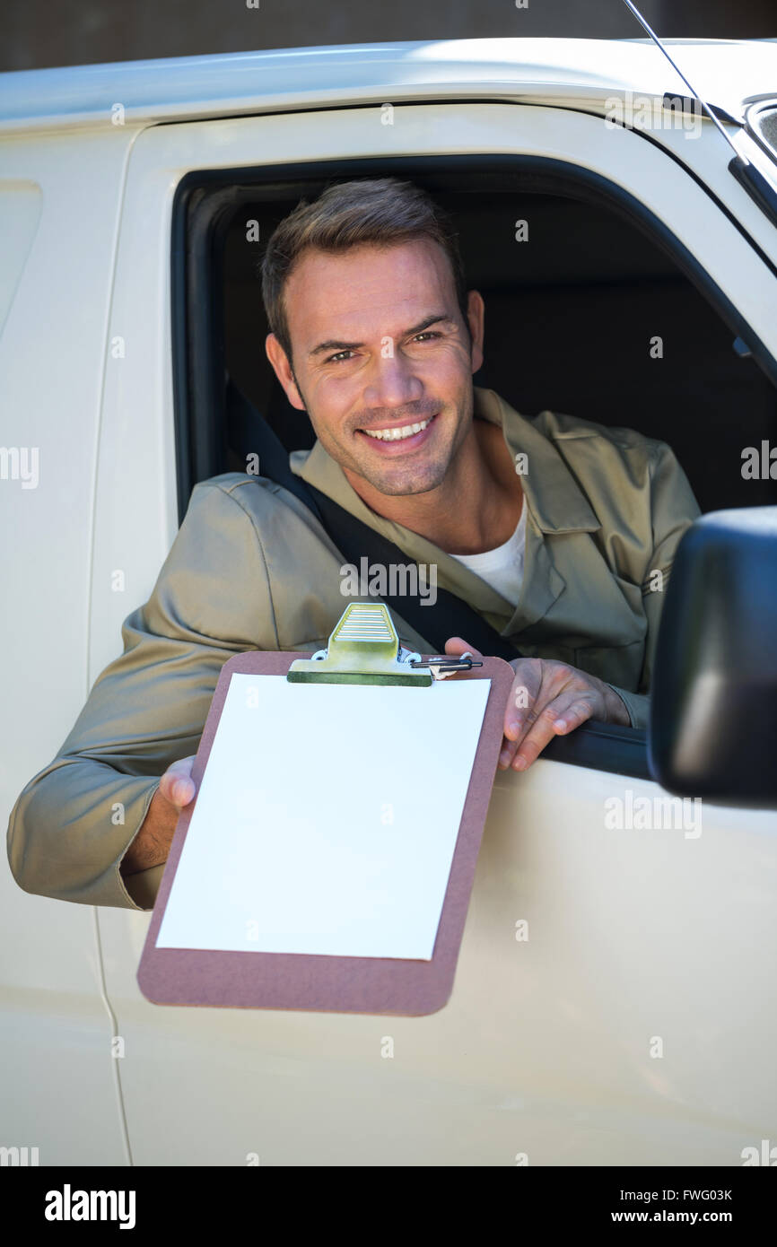Delivery man sitting in his van Stock Photo - Alamy